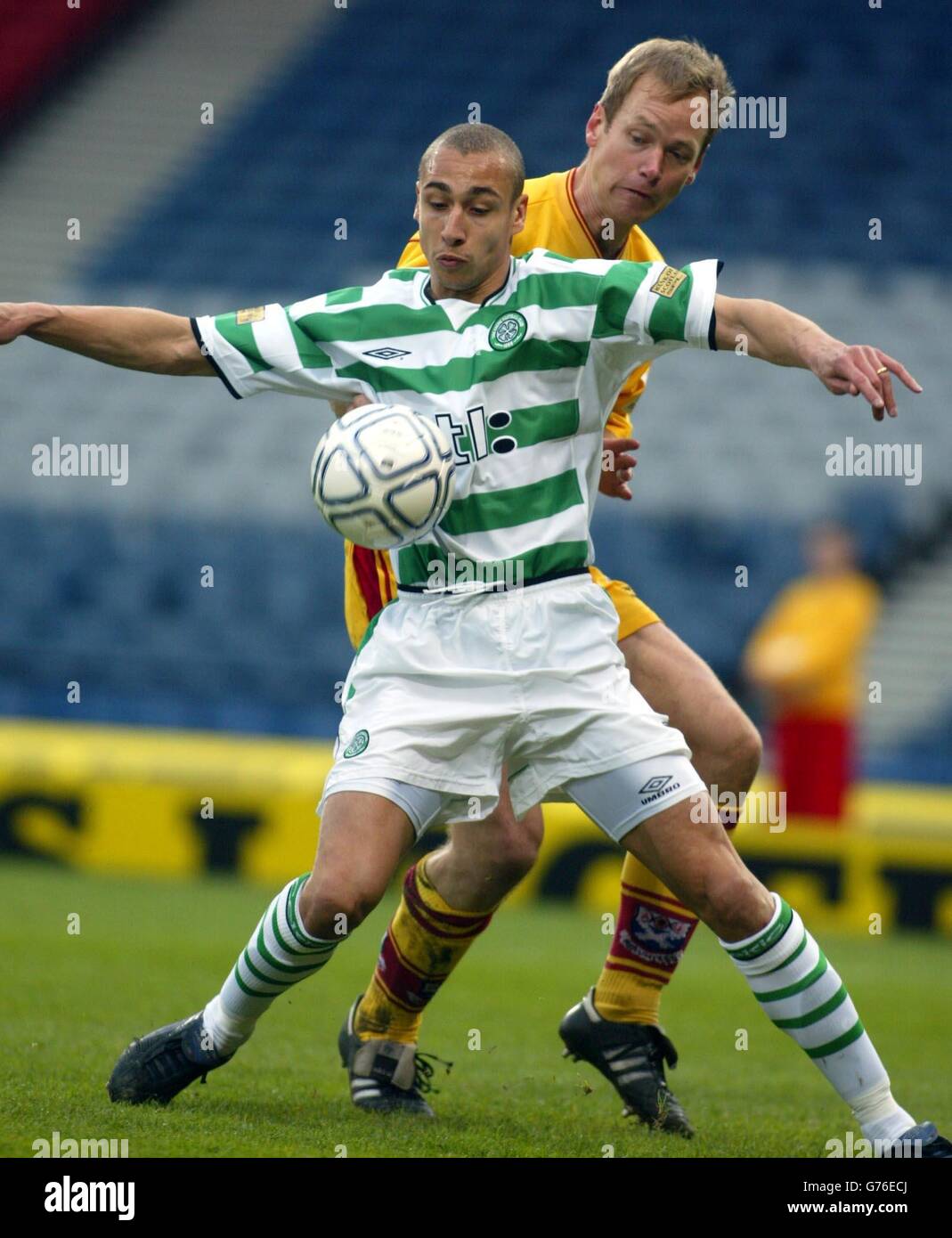 Celtic's Hendrik Larsson screens the ball from Ayr United's Neil Duffy ...
