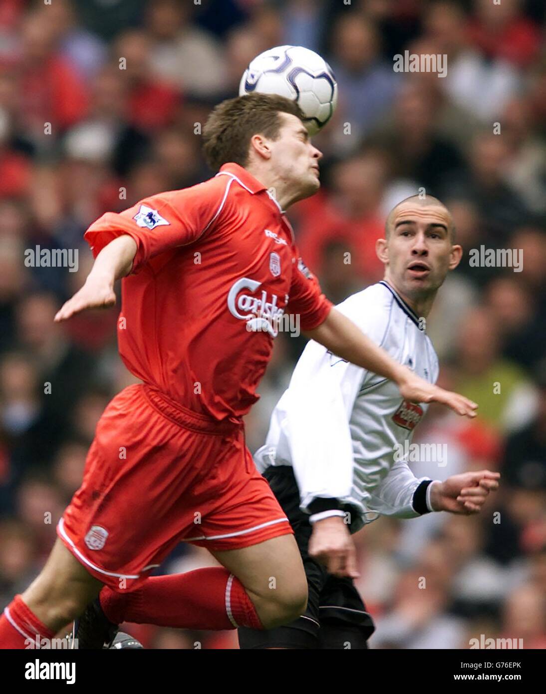 Liverpool striker Michael Owen challenges Derby County's Danny ...