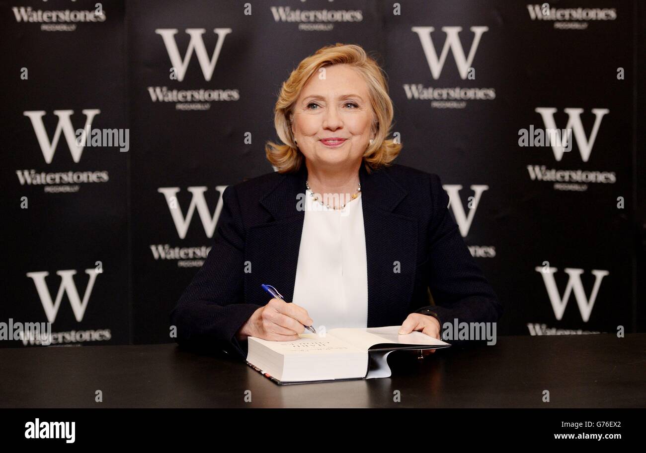 Former U.S. Secretary of State Hillary Clinton signs her new book ...