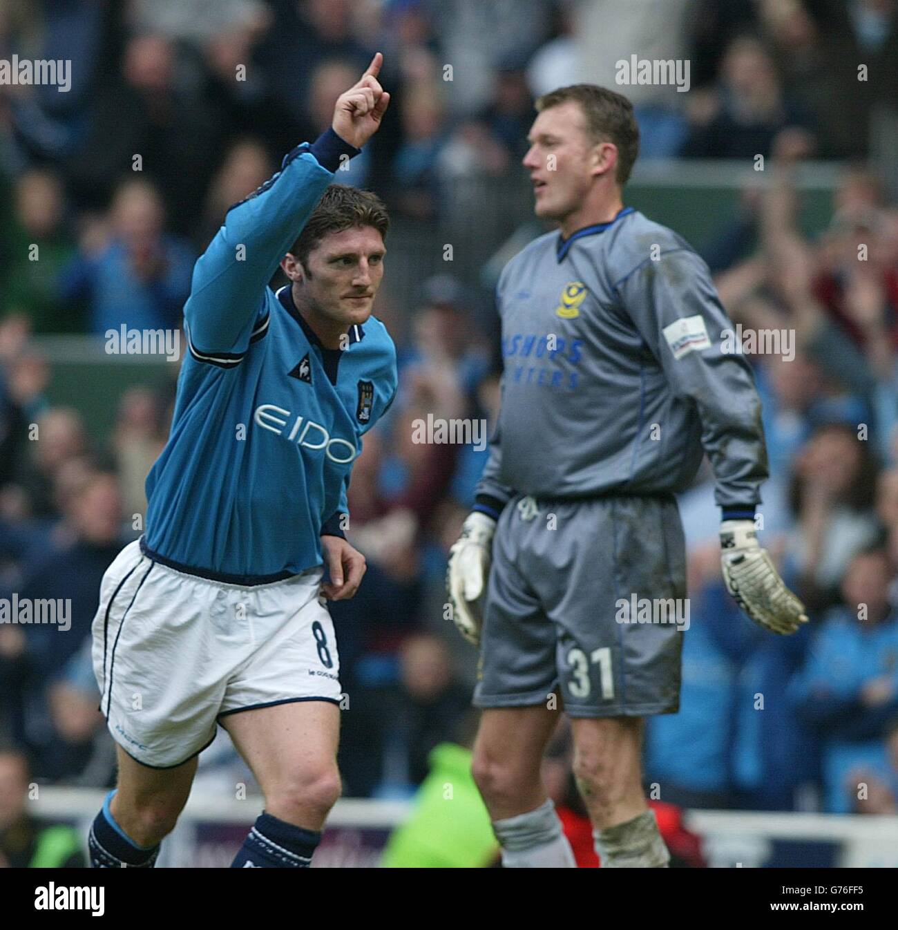 Manchester City's Jon Macken (left) celebrates his goal against ...