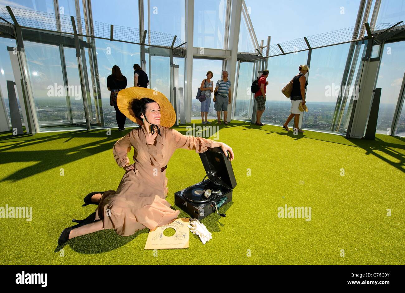 Maureen Schipper sits on the new artificial lawn at the View From the ...