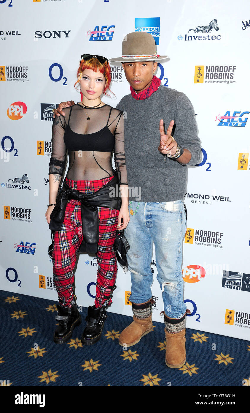 Maxine Ashley and Pharrell Williams arriving at the O2 Silver Clef ...