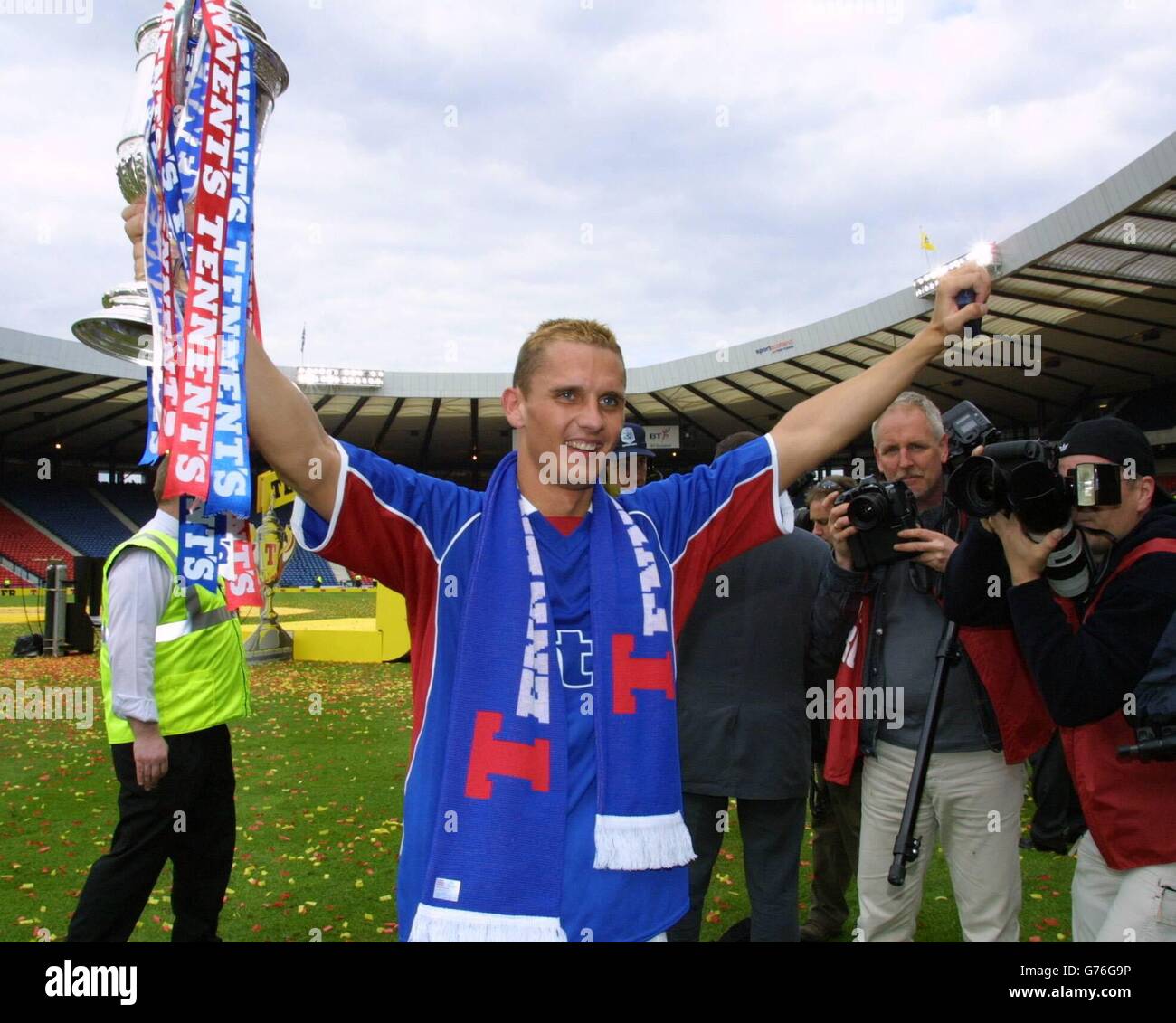 Rangers' Peter Lovenkrands celebrates winning the Tennent's Scottish ...