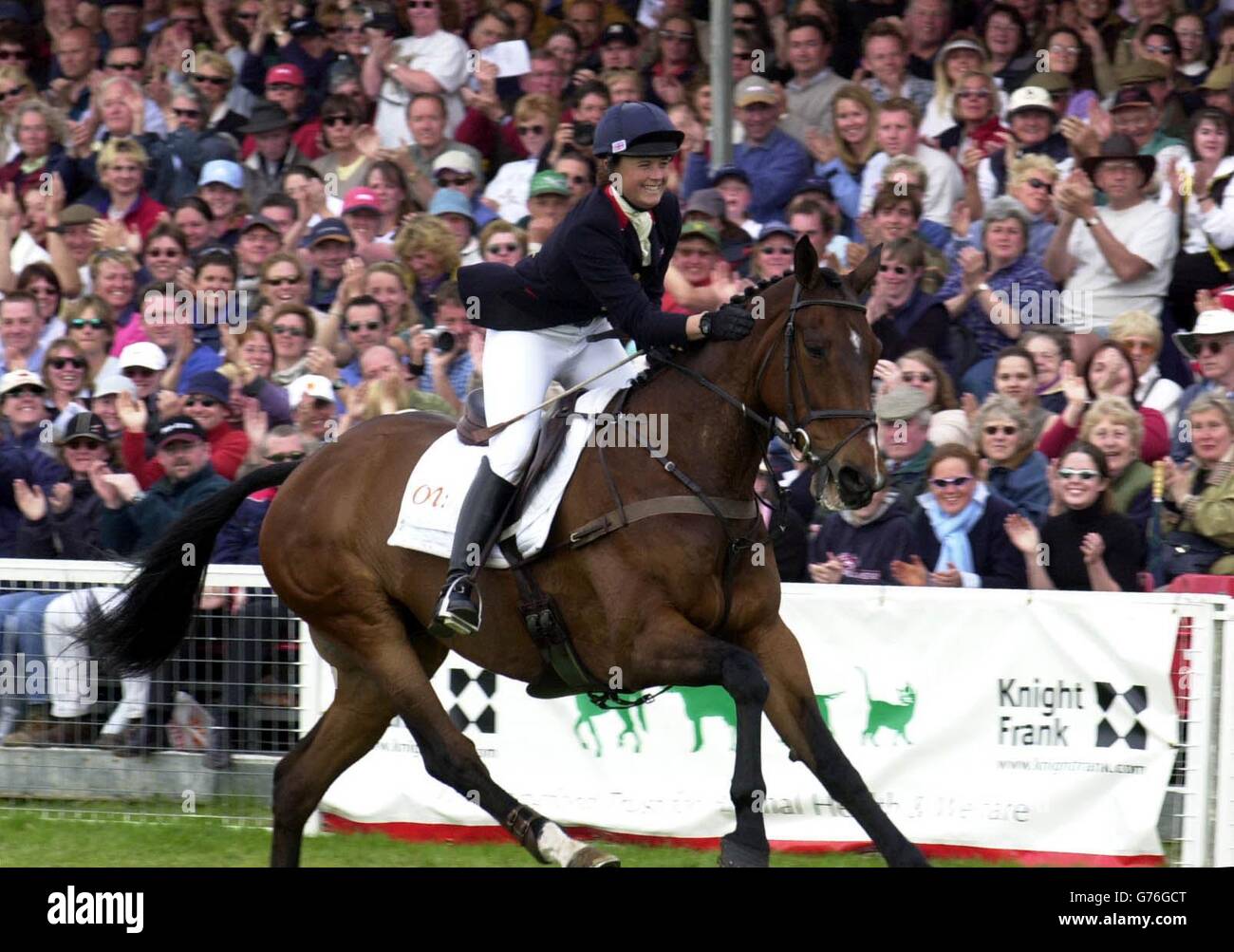 Rider, Pippa Funnell on Supreme Rock from Dorking, take a lap of honour ...