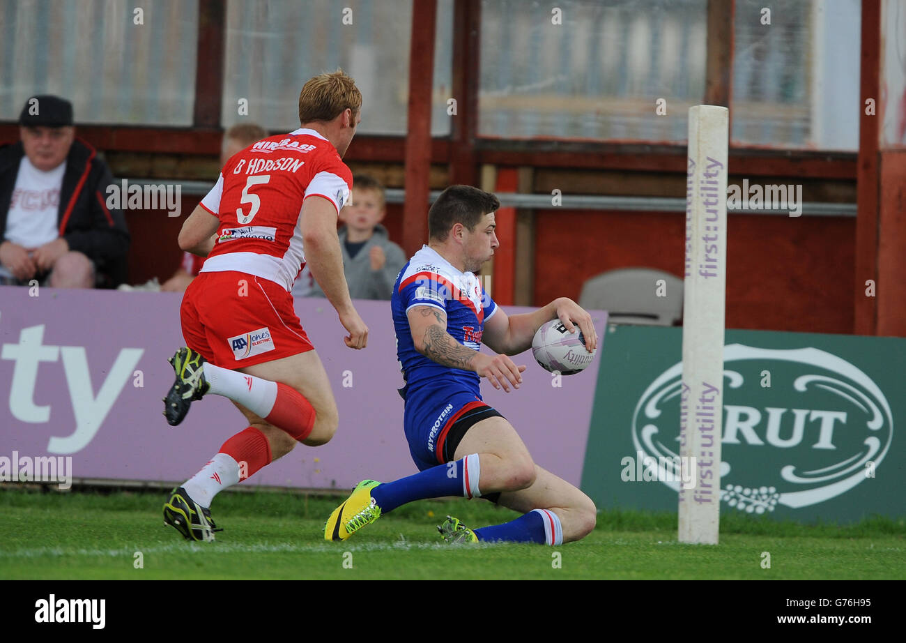 St Helen's Mark Percival scores his sides opening try of the game under ...