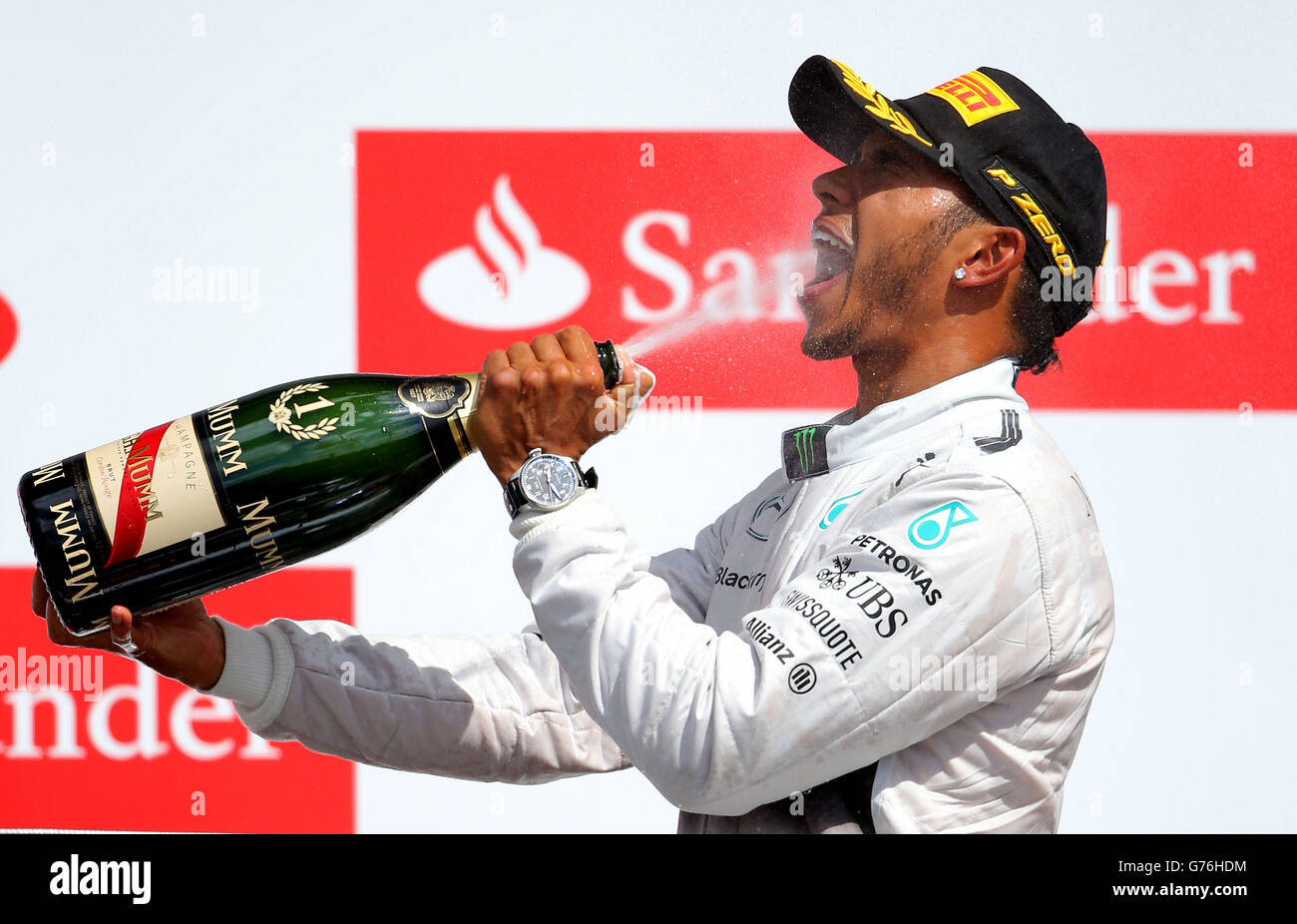 Mercedes' Lewis Hamilton celebrates winning the 2014 British Grand Prix ...