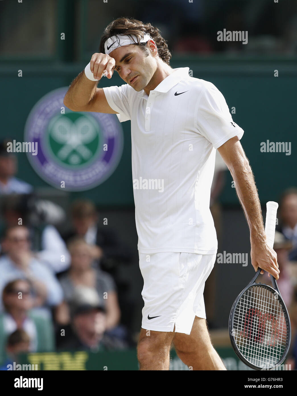 Switzerland's Roger Federer reacts against Serbia's Novak Djokovic in ...