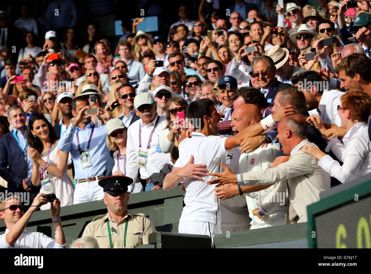Serbia's Novak Djokovic goes to his players box after beating ...