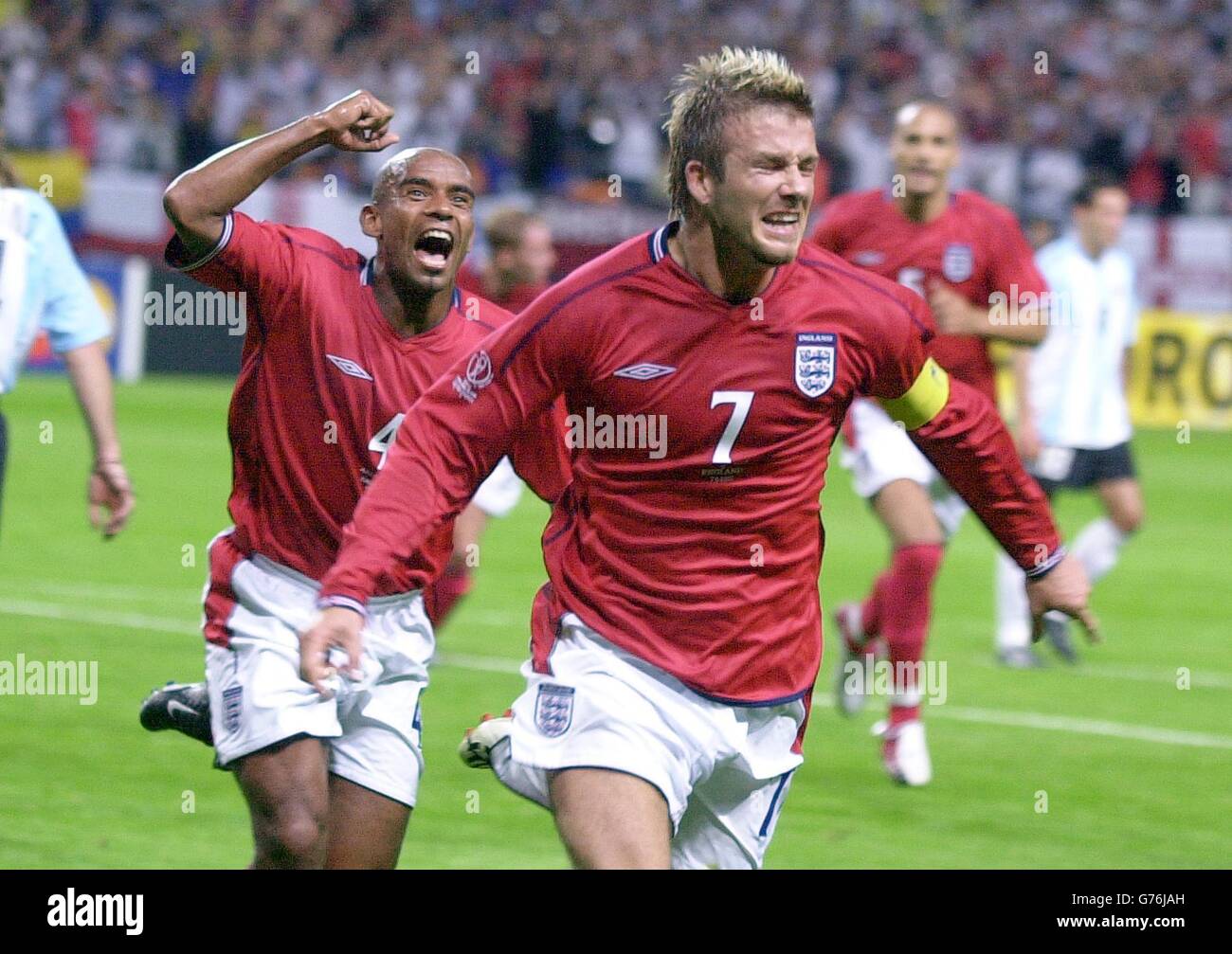 England captain David Beckham (right) celebrates with team mate Trevor ...
