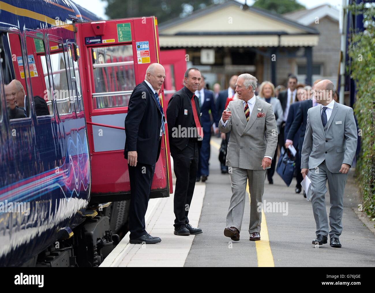 The Prince of Wales makes his way along the platform with Mark Hopwood ...