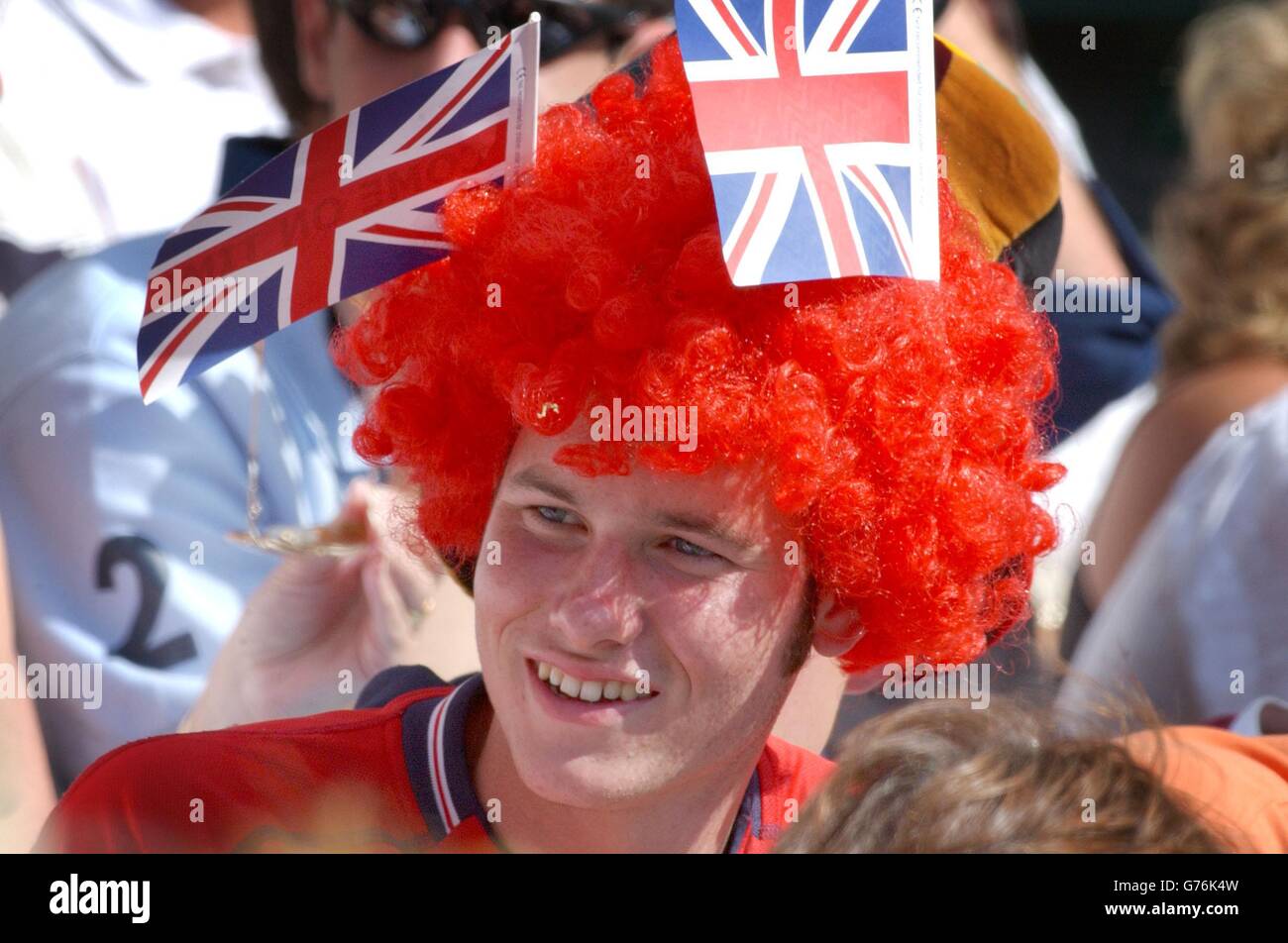 , NO COMMERCIAL USE. A patriotic tennis fan watches Britain's number ...