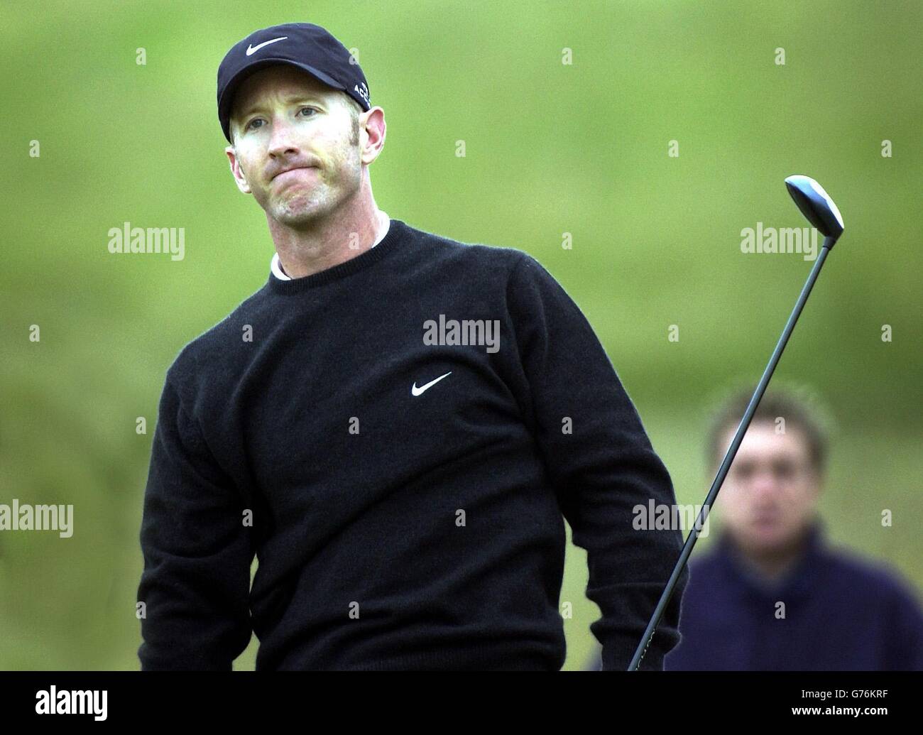 Last year's winner David Duval follows his ball after teeing off on the ...