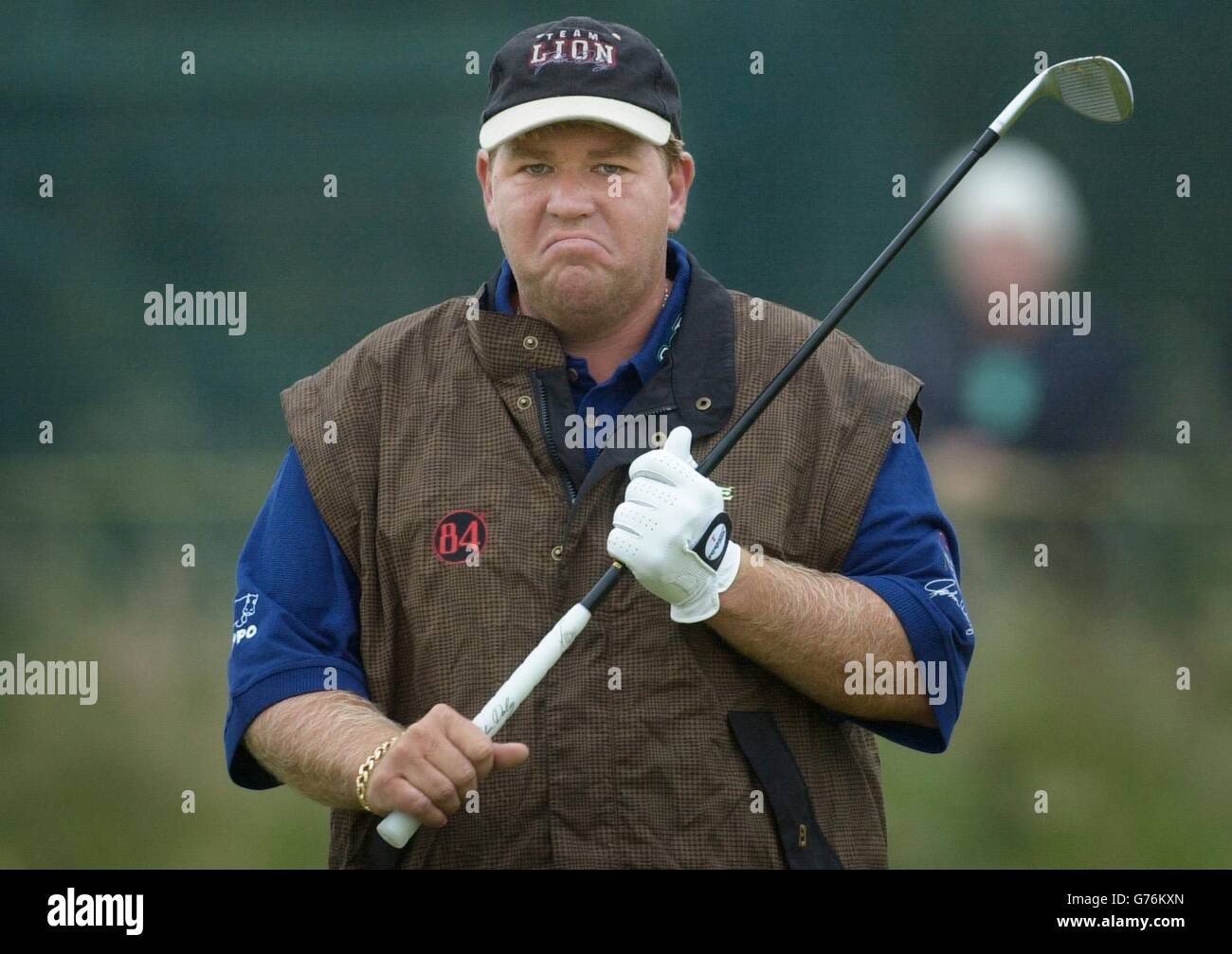 The USA's John Daly grips his club as he leaves the first green on the ...