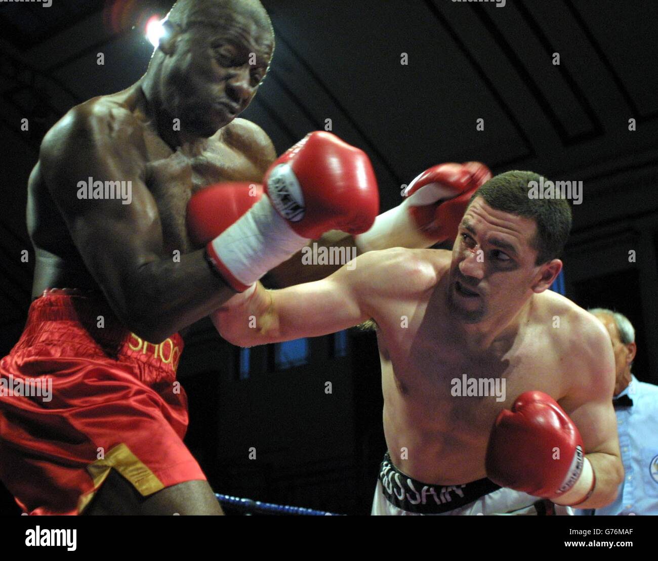Hussain Osman (r) lands a punch on Gary Logan in the WBO ...