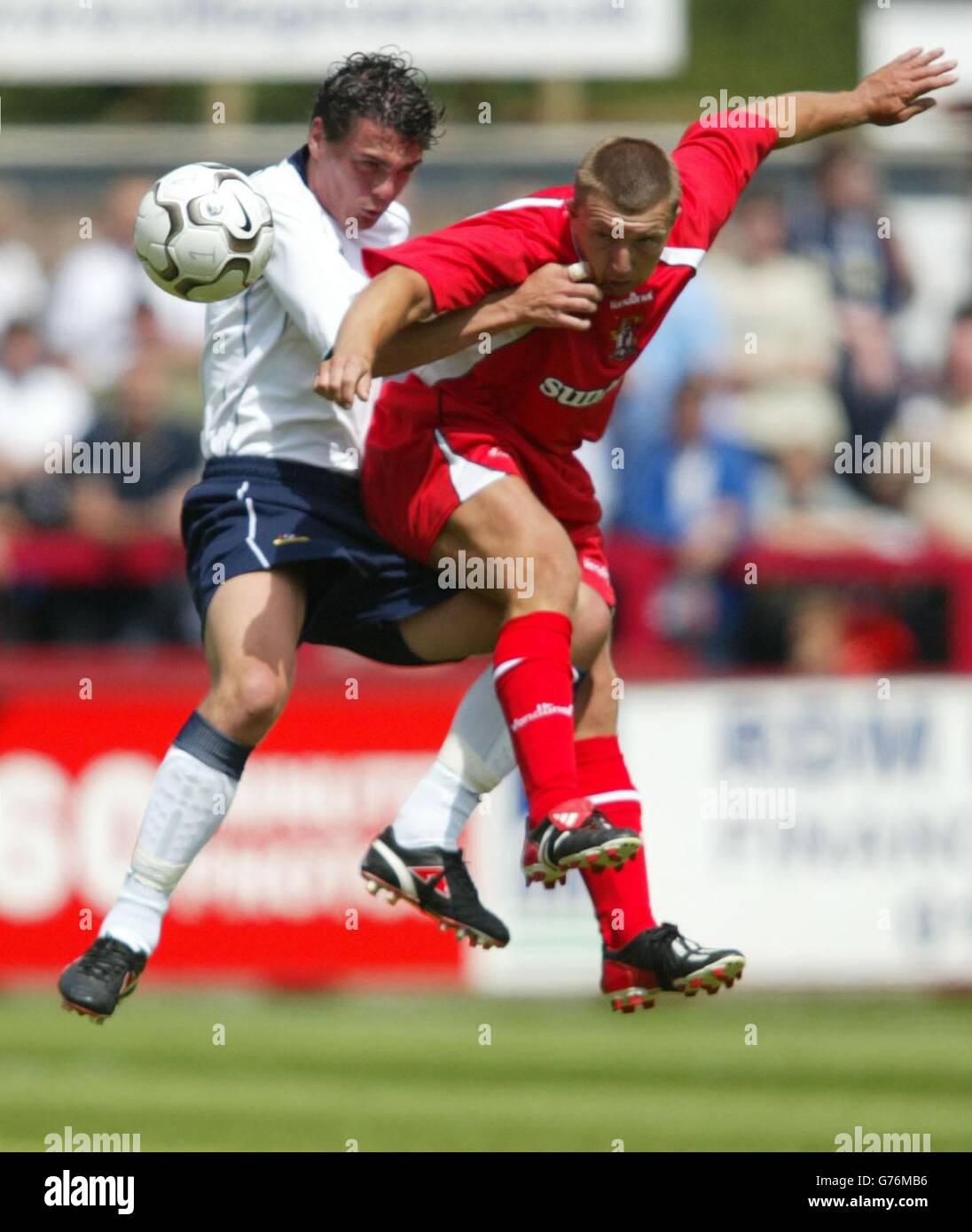 Tottenham's Milenko Acimovic and Stevenage's Scott Houghton battle for ...