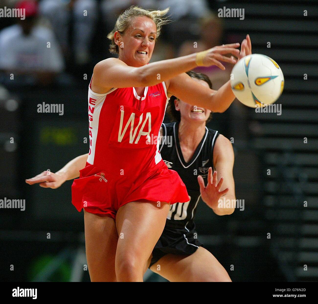 England's Tracey Neville fumbles a pass infront of New Zealand's Lesley ...