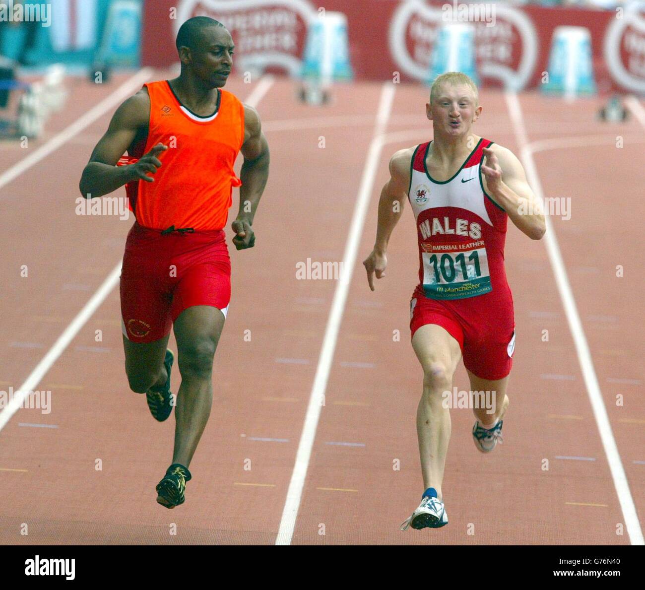 Blind Welsh sprinter Neville Bonfield (right) and his guide cross the ...