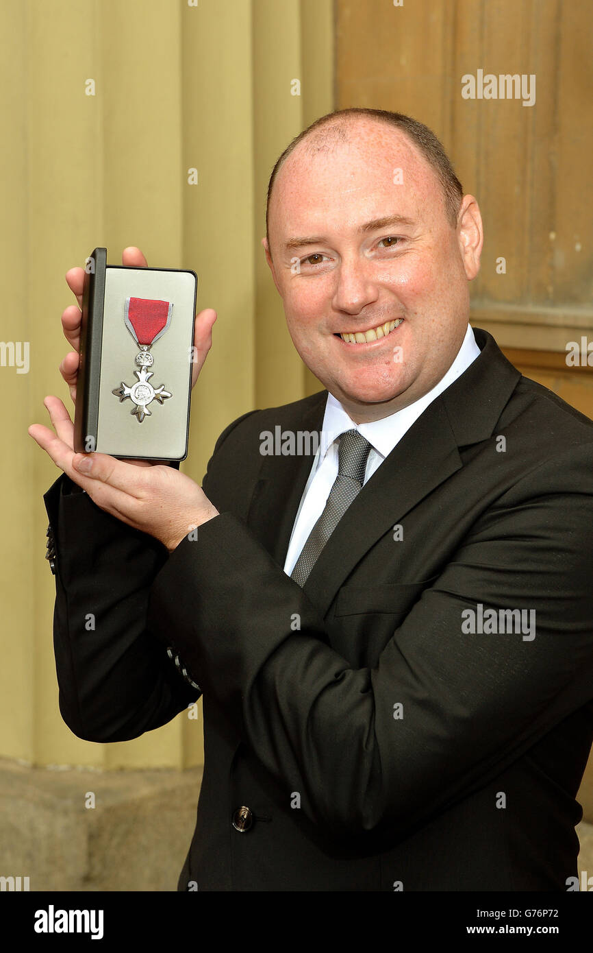 Matthew Searle proudly holds his Member of the Order of the British ...