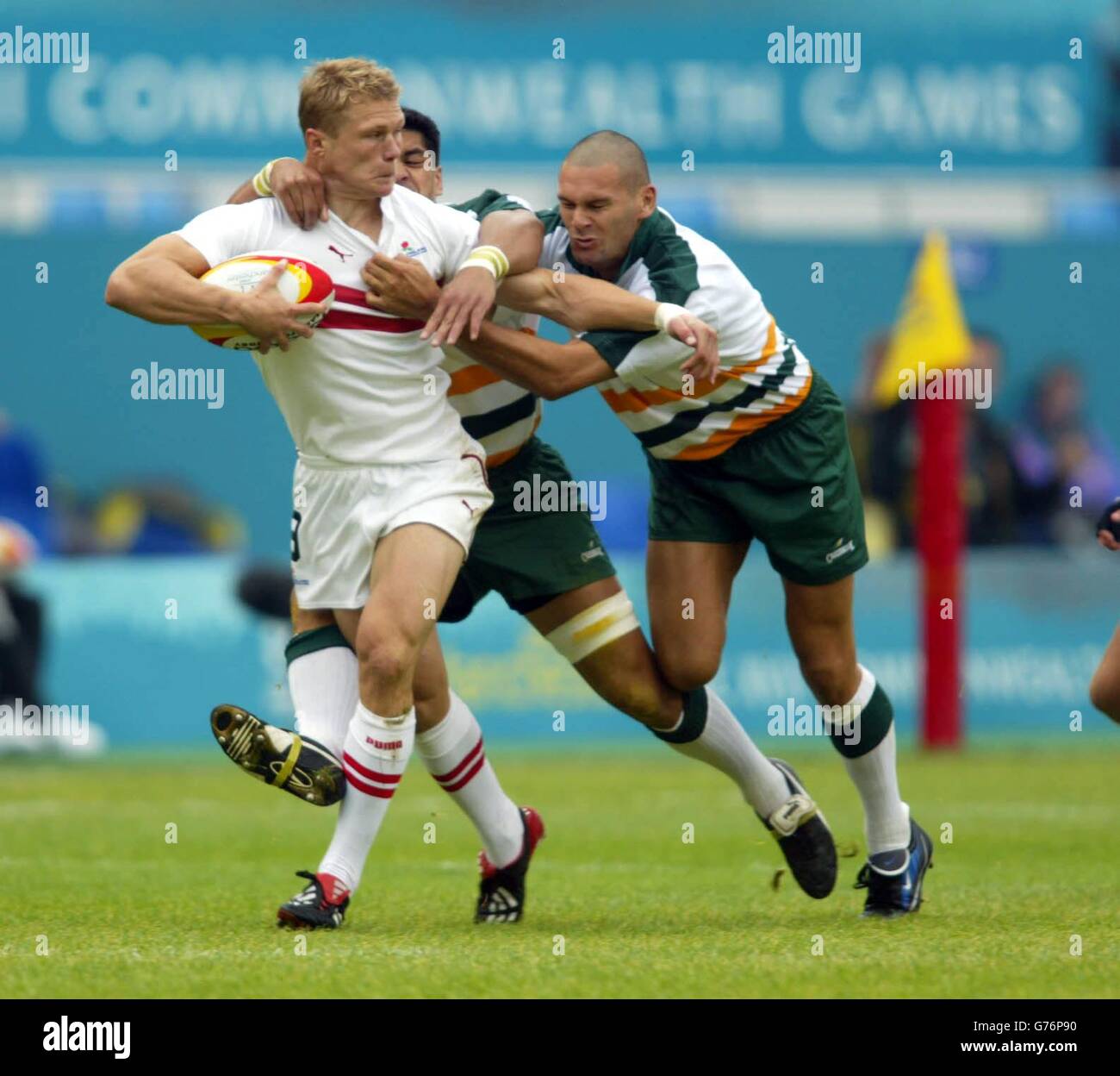 England's Josh Lewsey is tackled by Cook Islands' defence during a pool ...
