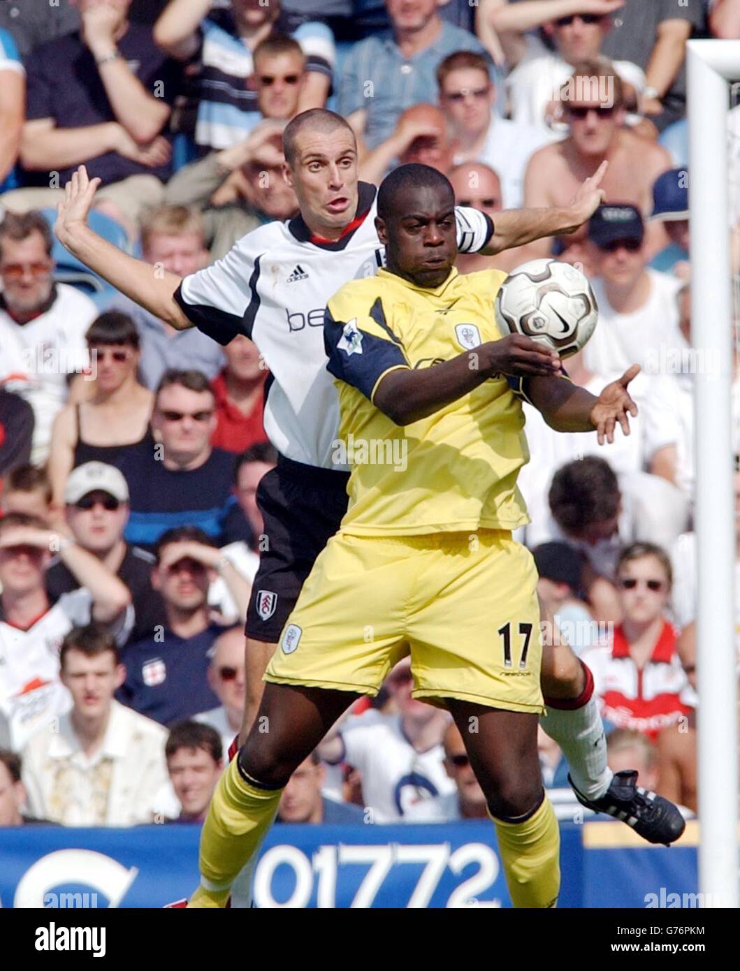 Bolton's Michael Ricketts (right) shields the ball from Fulham's Andy ...