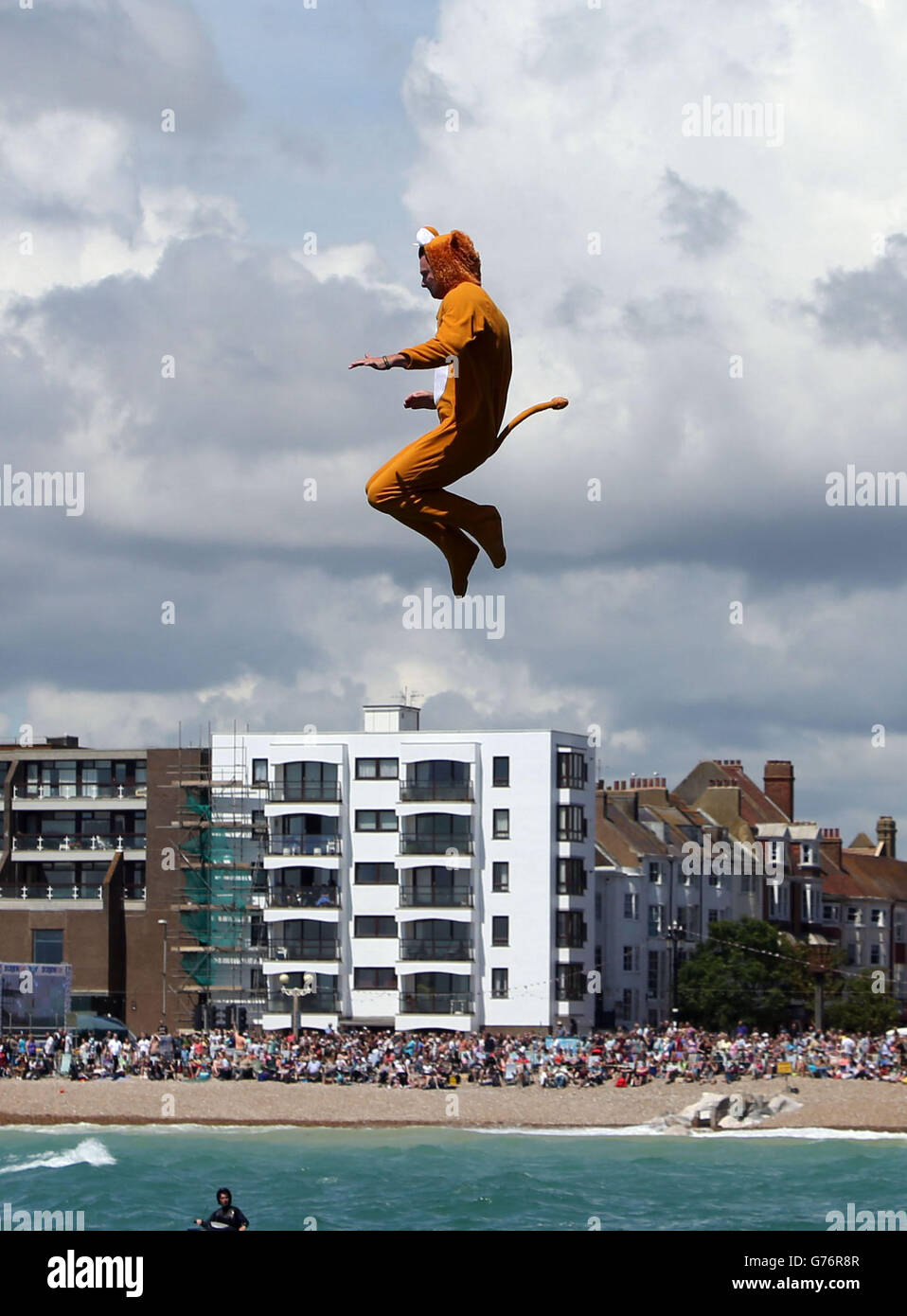 A man dressed as the lion from the Wizard of Oz jumps in the annual ...