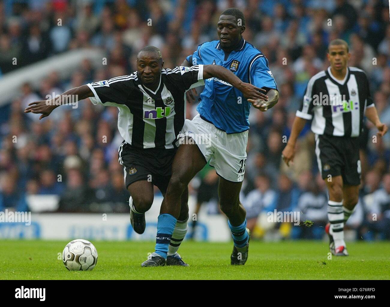 Newcastle's Lomana Lualua skips past Manchester City's Marc Vivien Foe ...