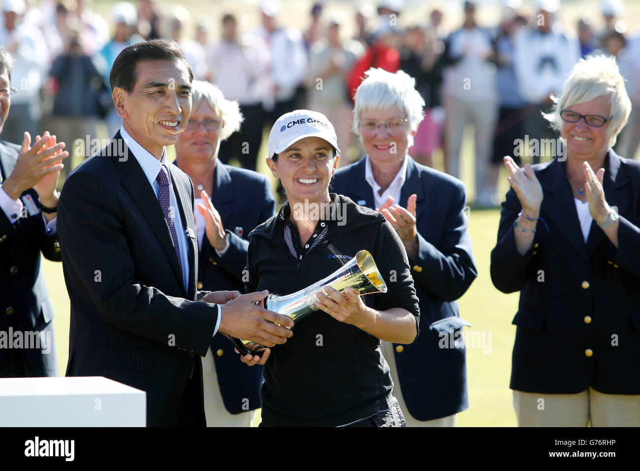 Mo Martin of Usa is presented with the British Open Trophy during day ...