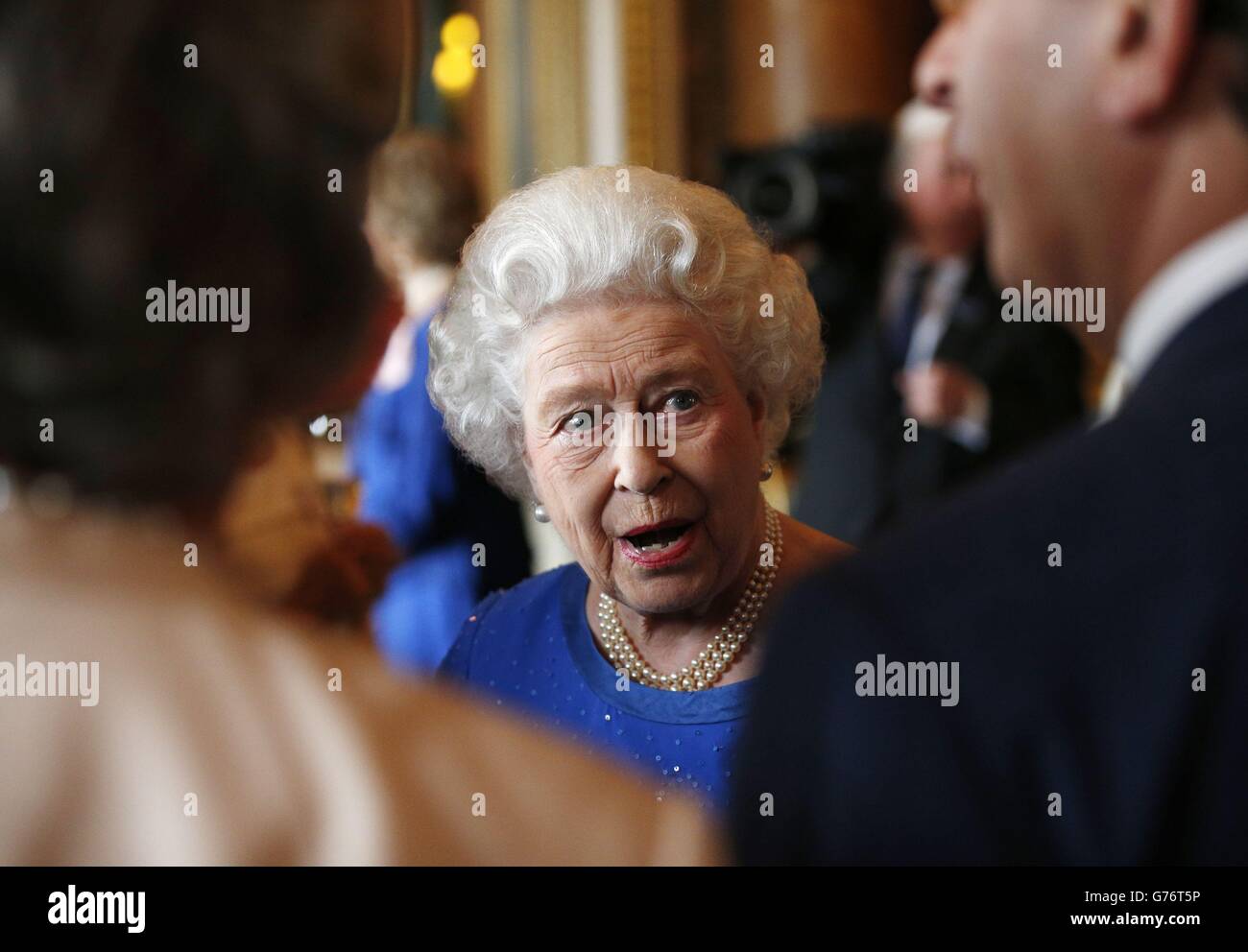 Queen Elizabeth II greets guests at a reception at Buckingham Palace ...