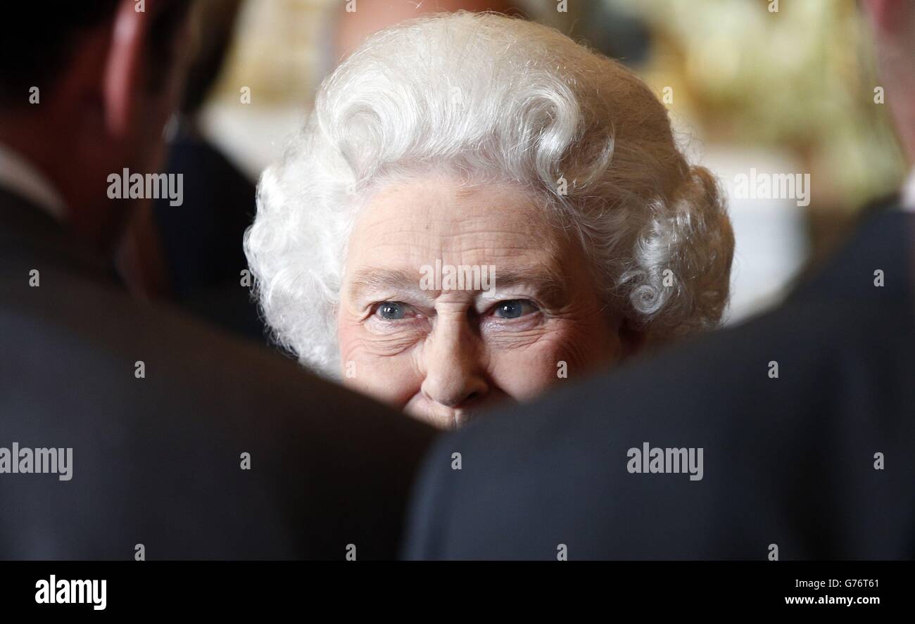 Queen Elizabeth II greets guests at a reception at Buckingham Palace ...
