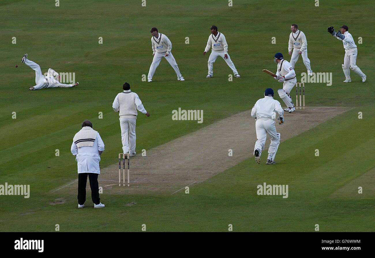 Yorkshire's last batsman Steven Kirby is dropped by Surrey fielder Ian ...