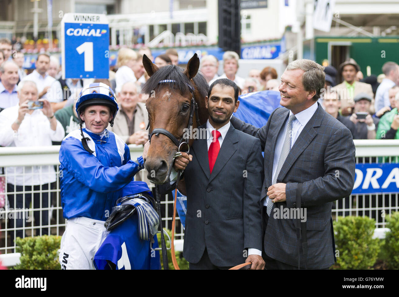 Jockey Paul Hanagan and trainer William Haggas (right) with Mukhadram ...