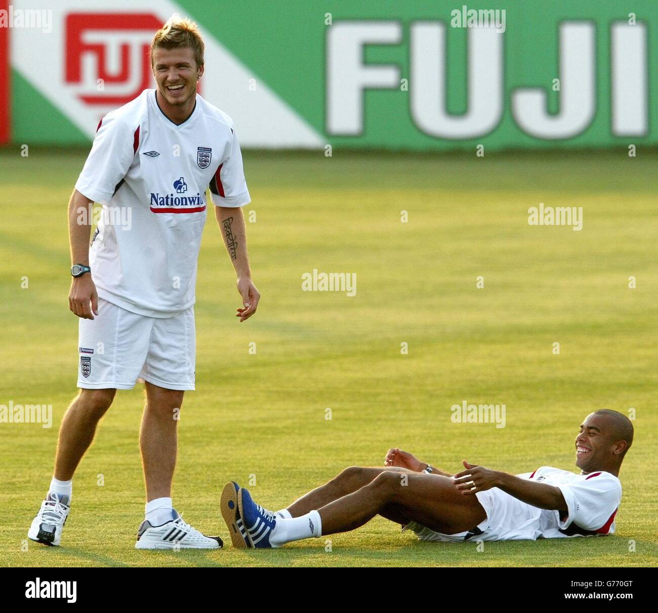 England captain David Beckham (left) with Ashley Cole warming down at ...