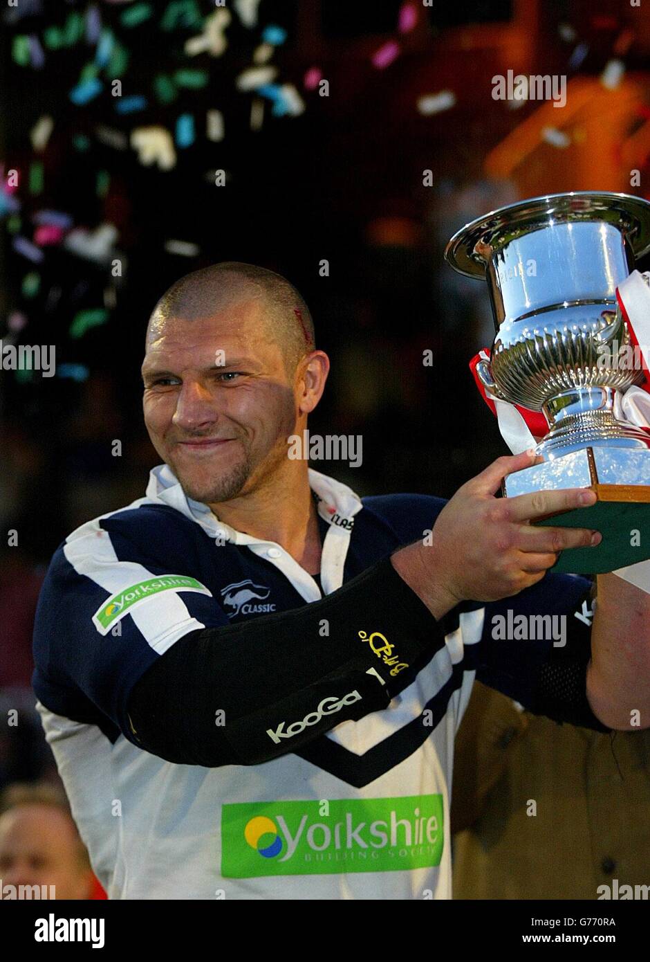 Lancashire captain Barrie McDermott (Leeds) holds the Origin trophy ...