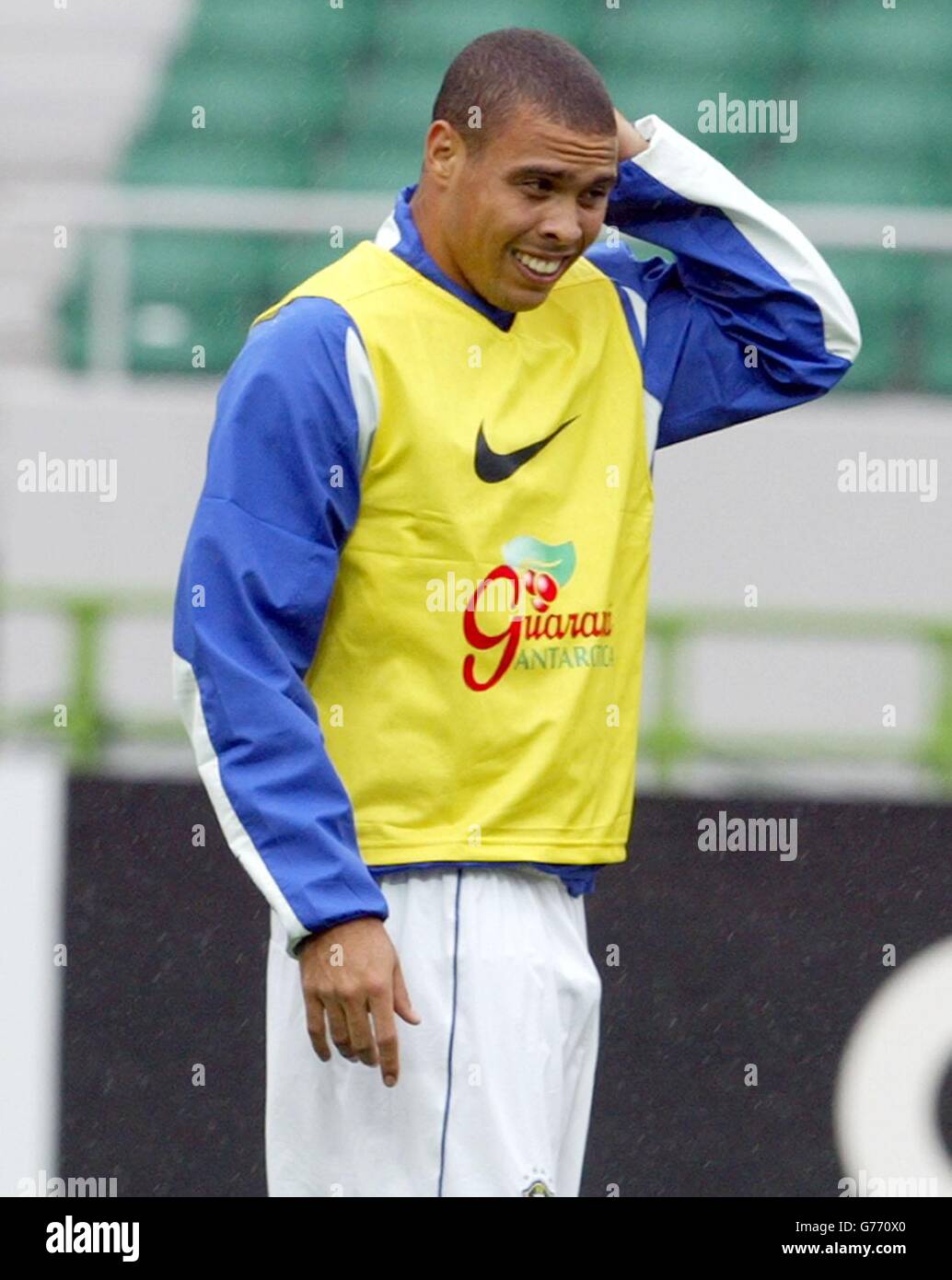 Brazil's Ronaldo scratches his head during a team training session at ...