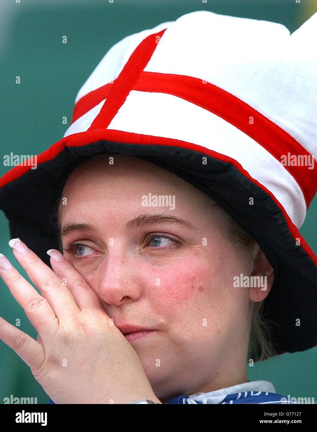 An England fan in tears after England are beaten 2-1 by Brazil in the ...