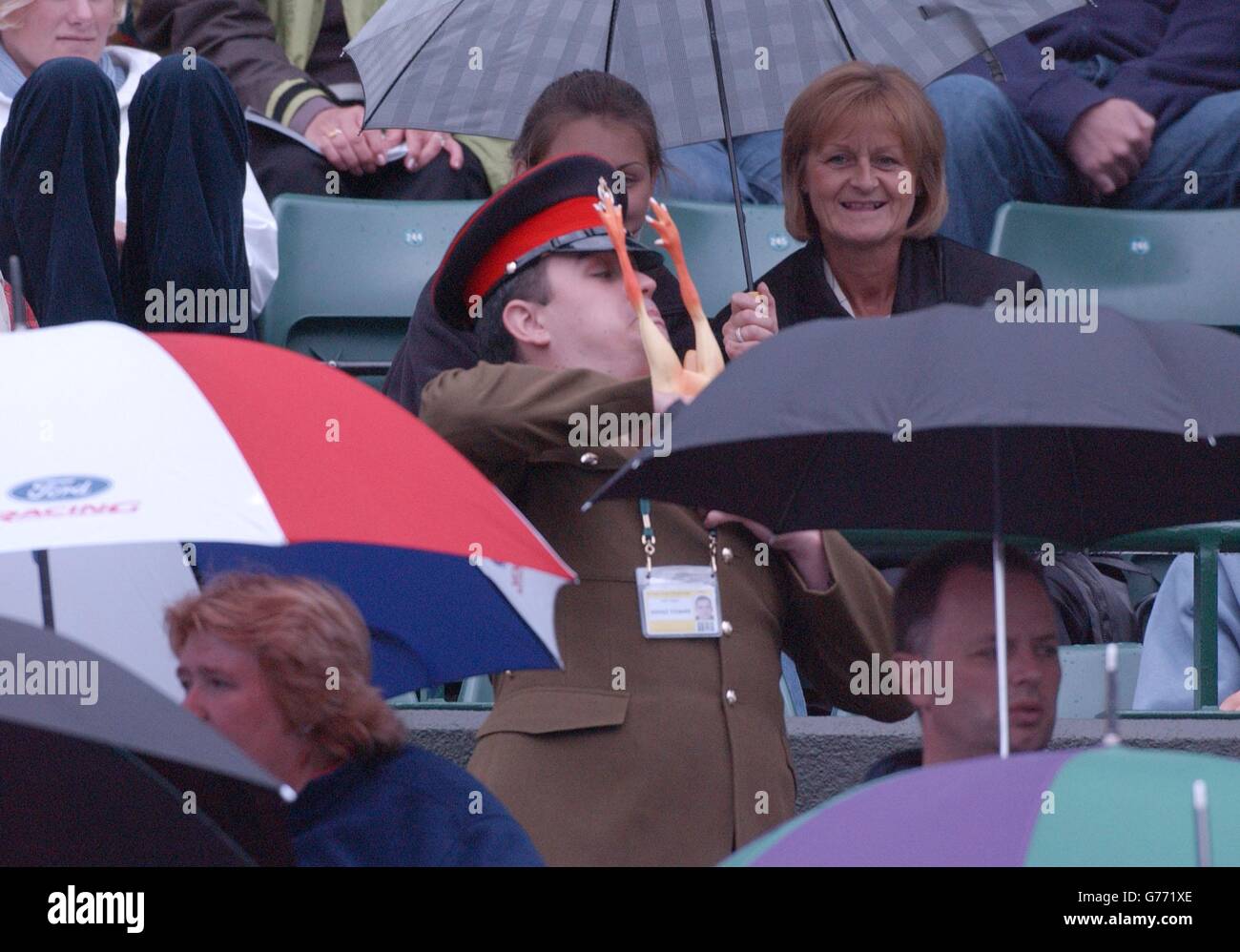 Sport tennis army security officers spectators umbrellas plastic ...