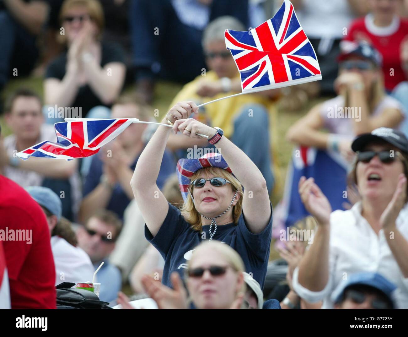 EDITORIAL USE ONLY, NO COMMERCIAL USE. Tennis fans on Henman Hill cheer ...