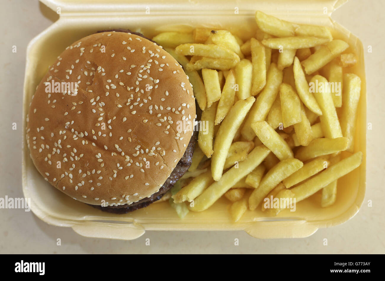 A generic stock photo of a half-pounder burger and chips in a takeaway ...