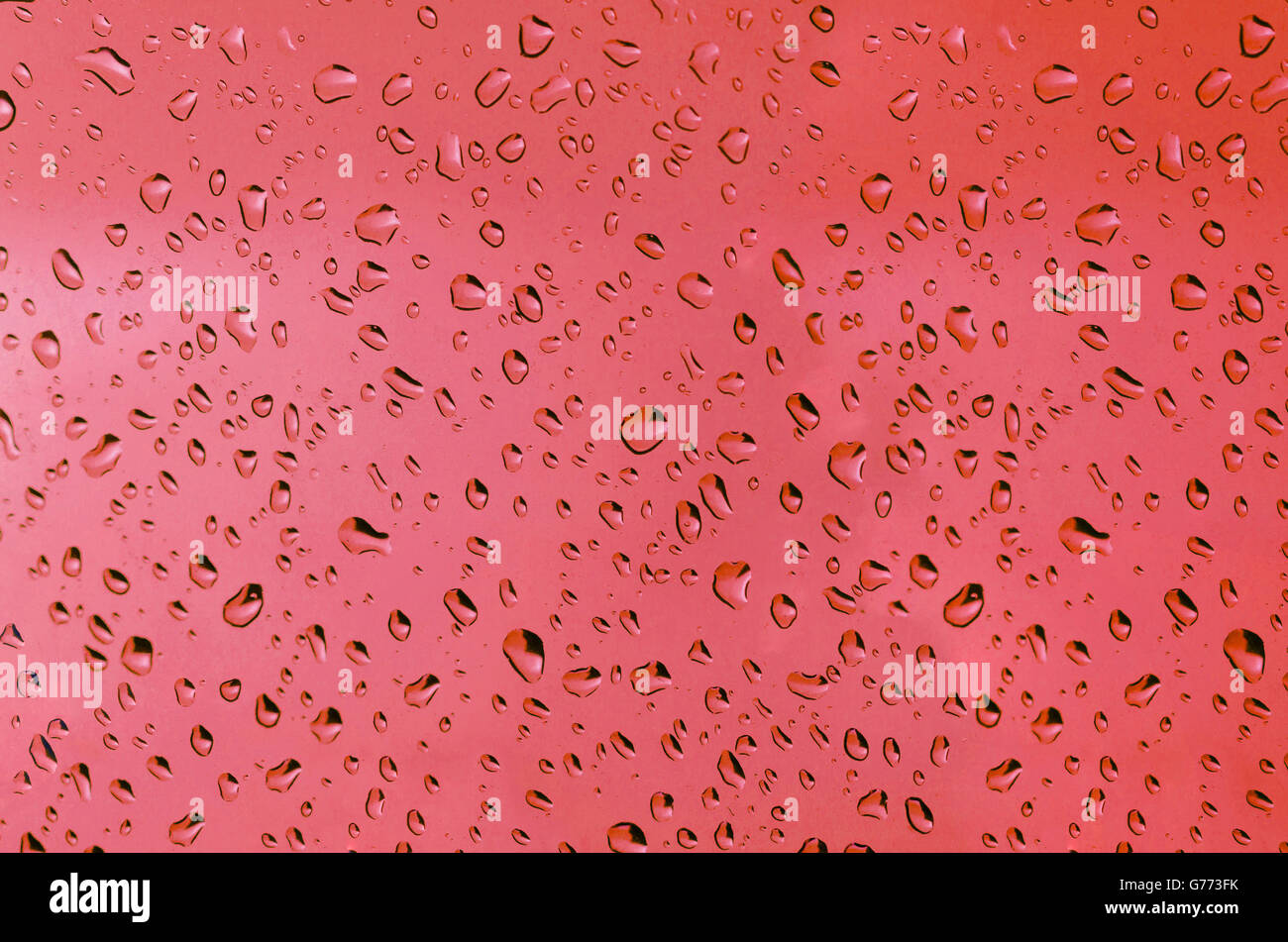 Water droplets on the glass with a colored background. Drops of water ...