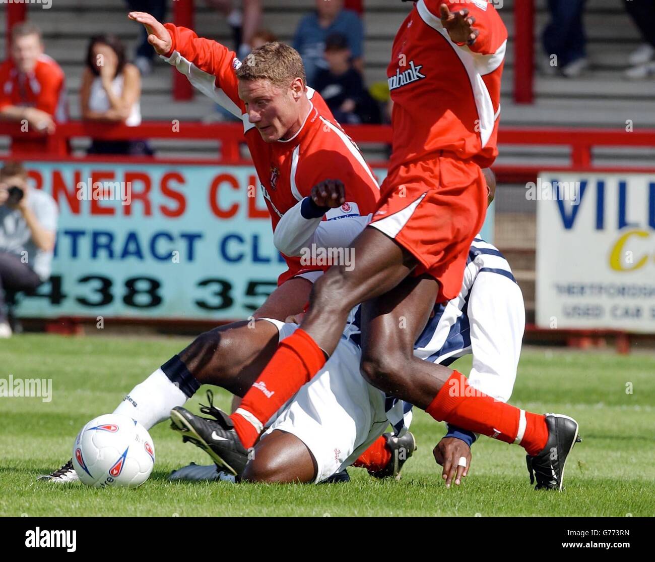 West Bromwich Albion's Jason Roberts is sandwiched by two Stevenaage ...