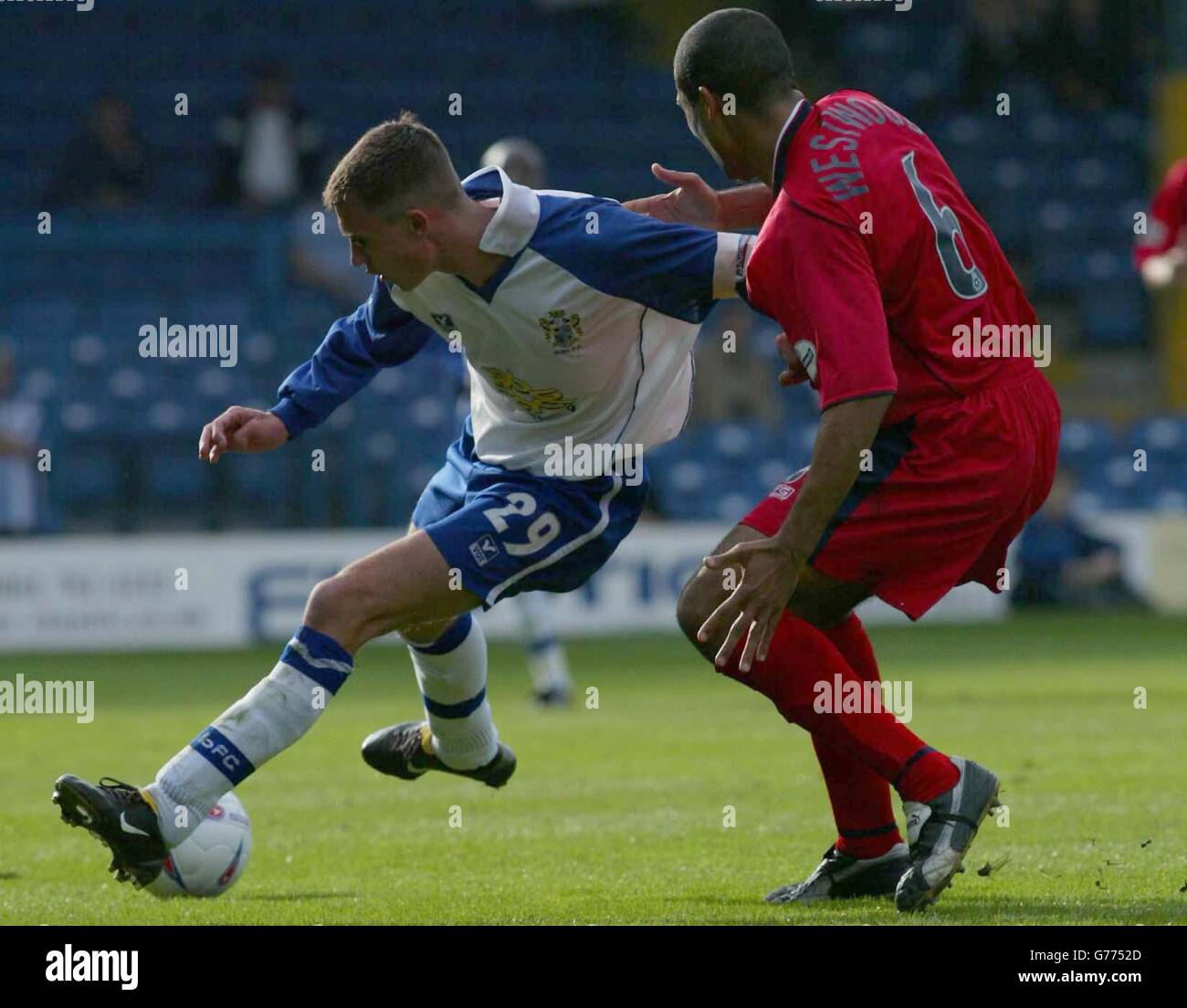 Bury's Jon Newby (L) keeping the ball from Hartlepool's Chris Westwood ...
