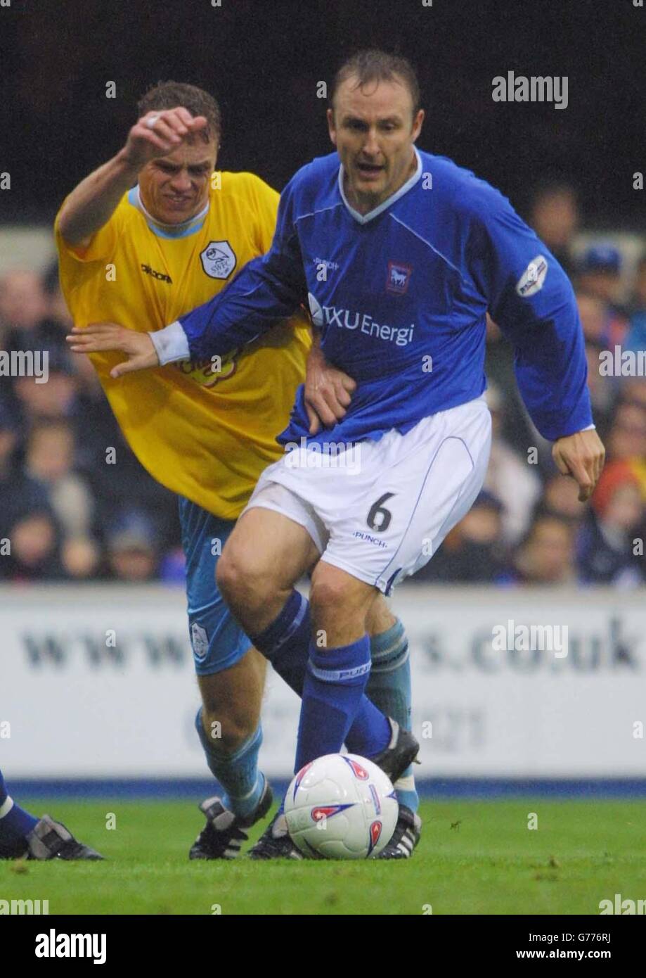 Ipswich Town's Mark Venus (R) holds off Sheffield Wednesday's Gerald ...