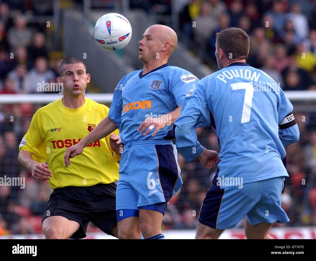 Watford's Jamie Hand (left) watches on as Grimsby Town's Stacy ...