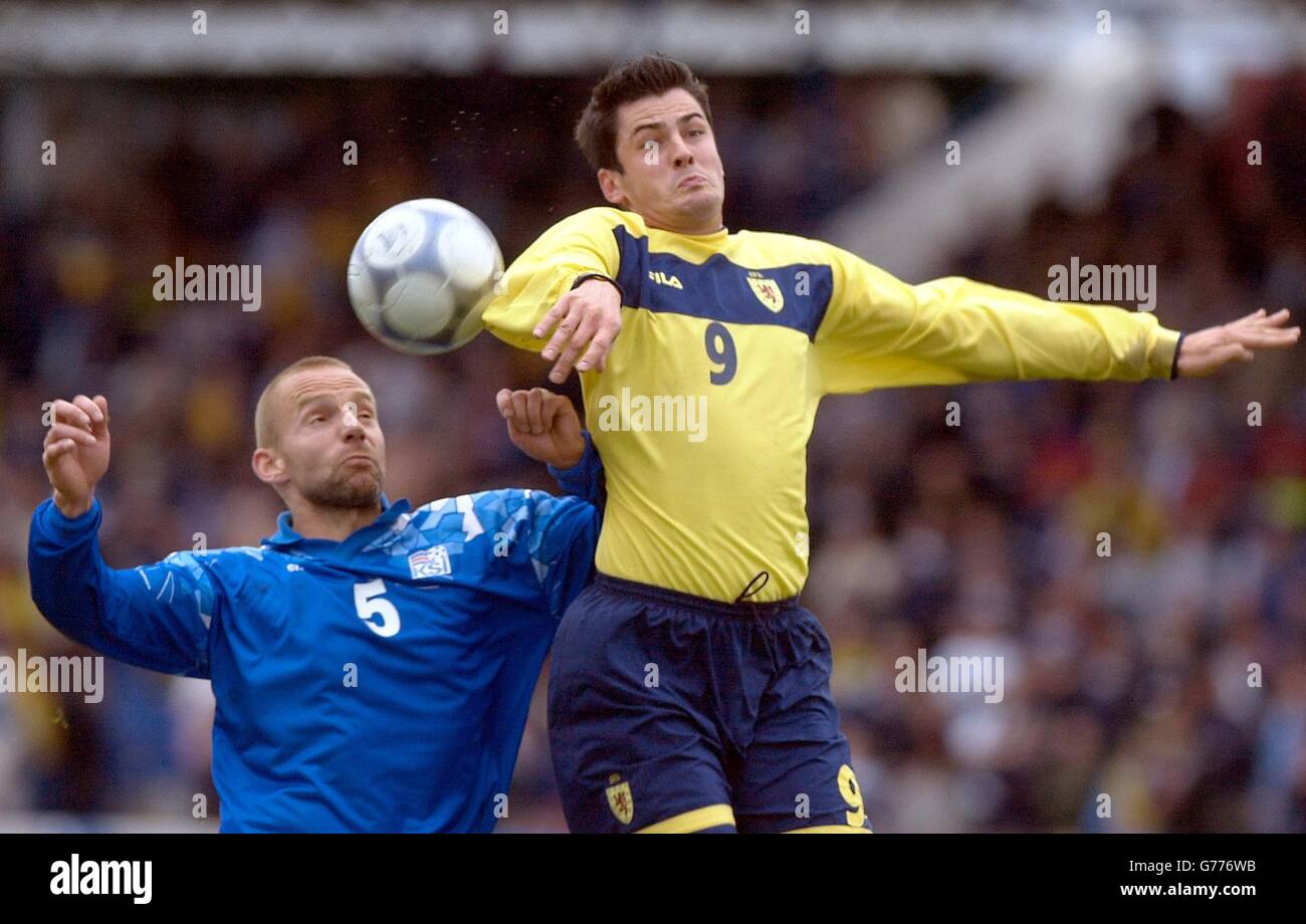 Scotland's Steven Thompson (right) wins an aerial ball from Iceland's ...