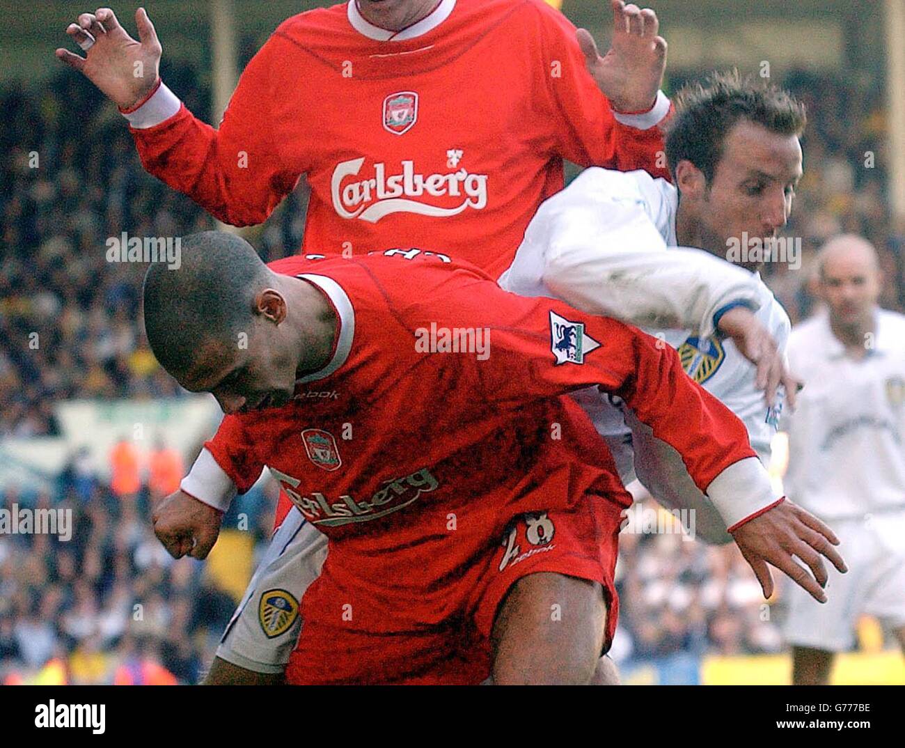 Lee Bowyer of Leeds United is sandwiched by Liverpool players as Bruno ...
