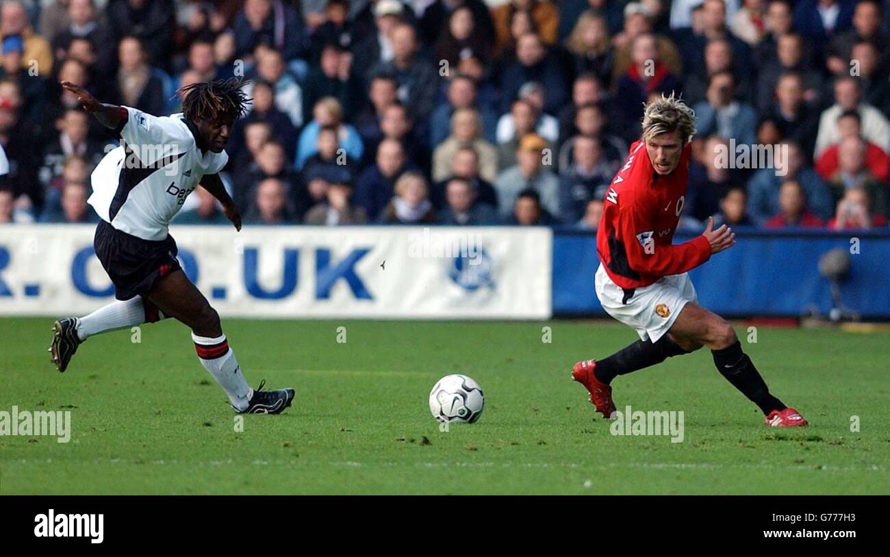 Man United captain David Beckham (right) and Fulham's Rufus Brevett eye ...