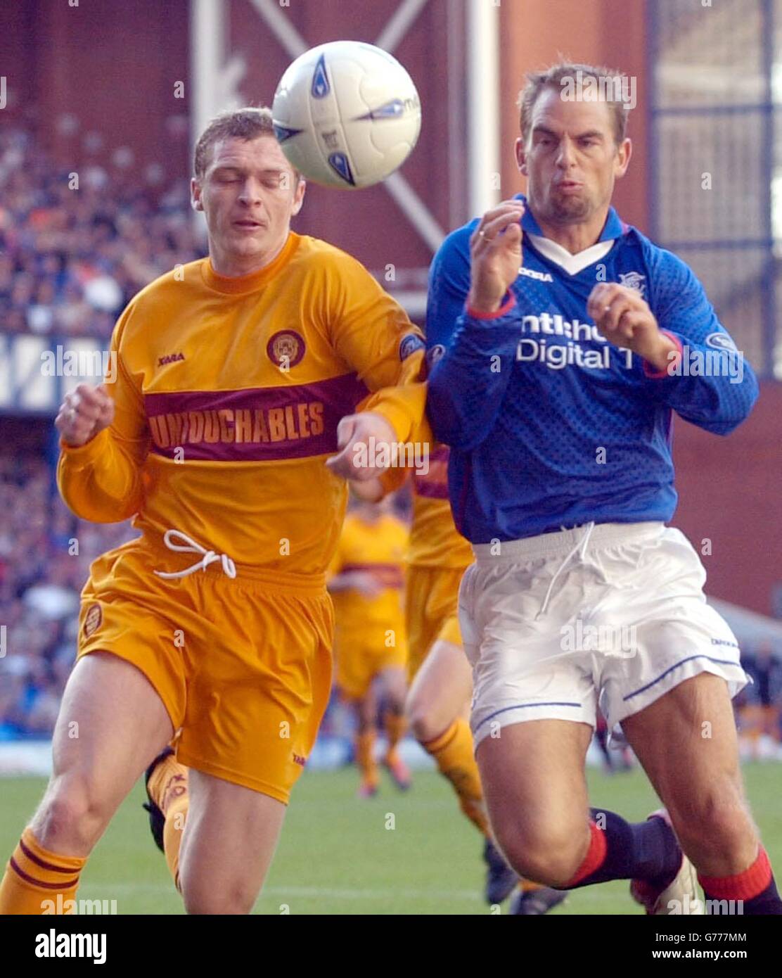 Rangers' Ronald De Boer (right) and Motherwell's Martyn Corrigan fight ...