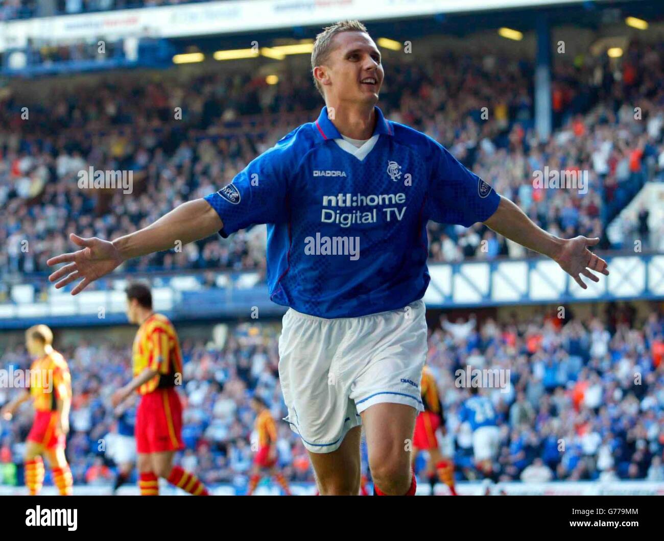 Rangers' Peter Lovenkrands celebrates his goal against Partick Thistle ...