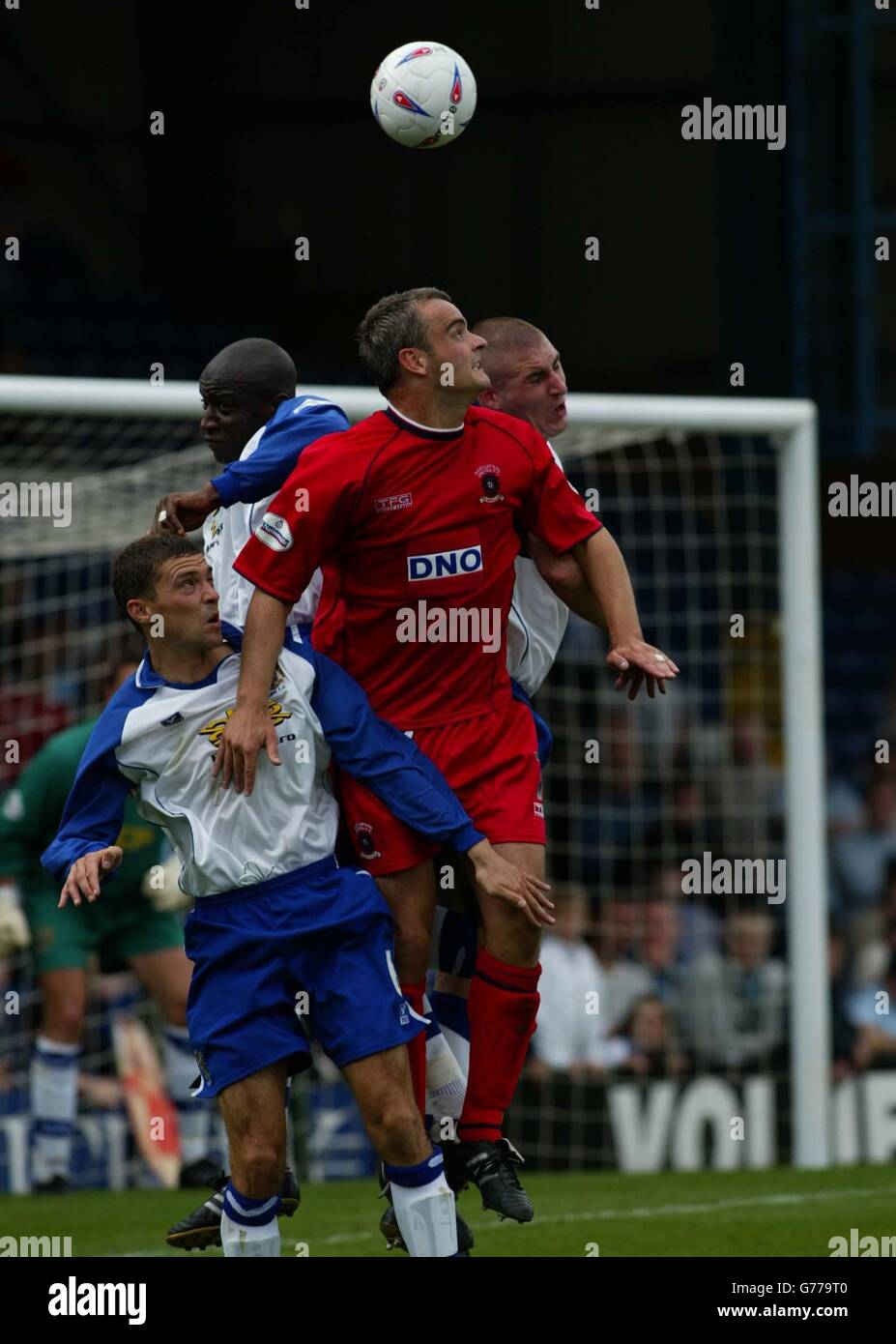 Hartlepool's Mark Tinkler (centre - red) climbing through the Bury ...
