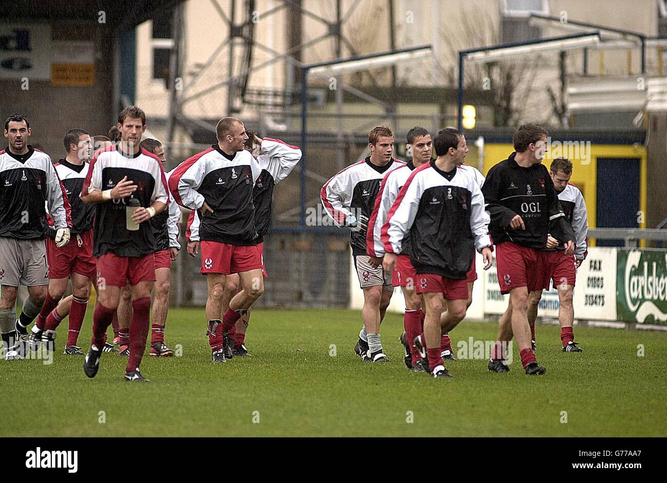 The players of Kidderminster Harriers show their disappointment as they ...